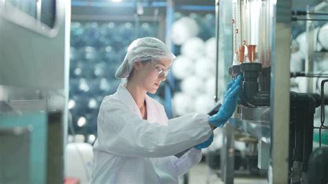 Scientist Woman Worker Checking And Monitoring The Control Panel On Machine System At The