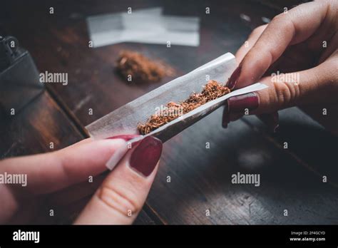 A High Angle Shot Of A Female Rolling A Joint Stock Photo Alamy