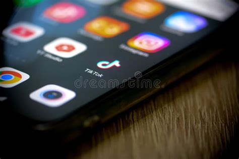 macro view of tiktok app in a smartphone screen editorial stock image