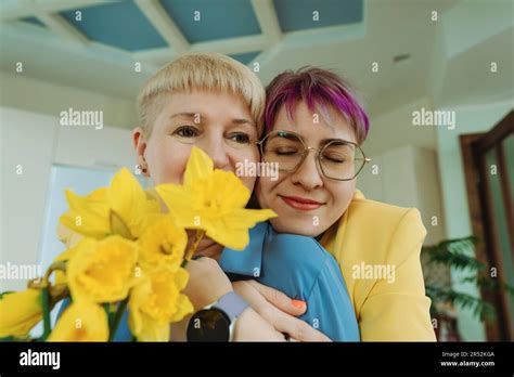 Heartwarming Embrace Babe Surprise 55 Year Old Mom With Anniversary Flowers Stock Photo Alamy