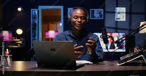 Portrait Of Bipoc Tech Vlogger Reviewing Newly Released Smartphone In
