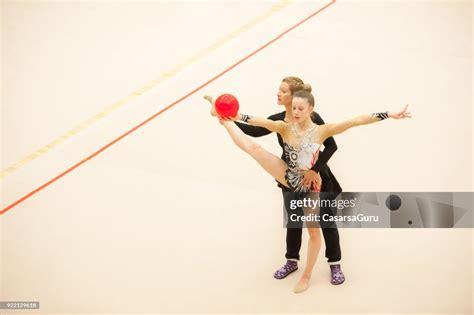 Coach Guiding Teenage Rhythmic Gymnastics Athlete During Training High-Res Stock Photo - Getty ...