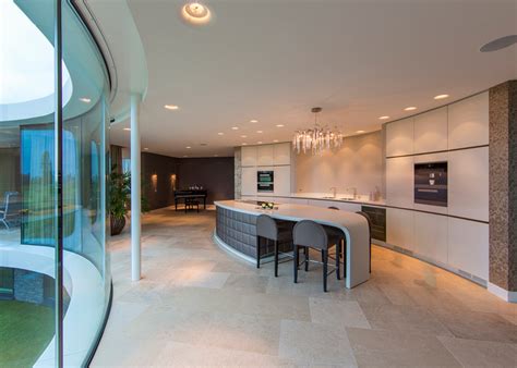 Corian Facade Wraps Around Waterside Dutch Home