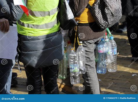People With Empty Plastic Water Bottles On A Protest Because Water