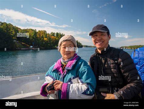 Mother And Son Posing For Photo On Cruise Ship On Saint Lawrence River