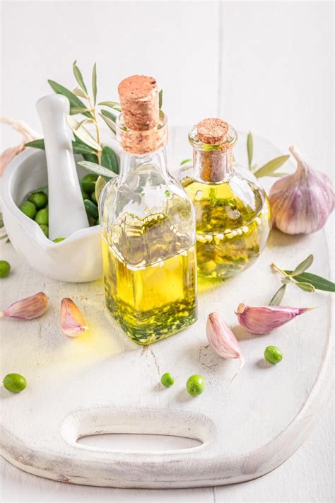 Premium Photo | Tasty and intense oil in bottle with garlic