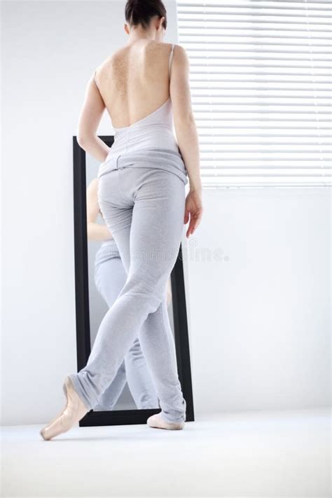 Her Every Line Must Be Perfect Rear View Of A Ballerina In Position