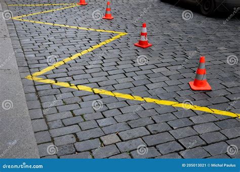 On The Side Of The Road Is A Yellow Zigzag Line That Prohibits Parking