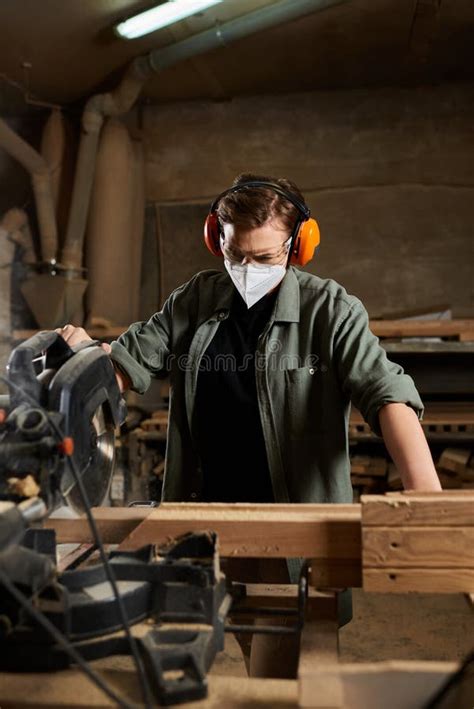 A Dedicated Carpenter Skillfully Preparing Wood Stock Image Image Of