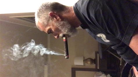 Cigar Smoking Inhales With Nose Jets