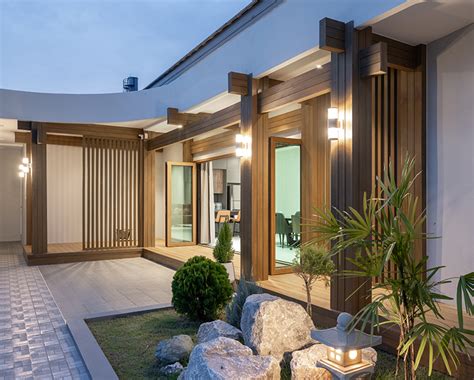Wooden Folding Blinds Invite Greenery Within Residence In Thailand