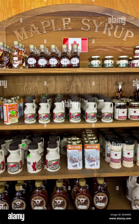 Maple Syrup Display Jars Bottles And Cans Of Canadian Maple Syrup On A Shelf In A Store