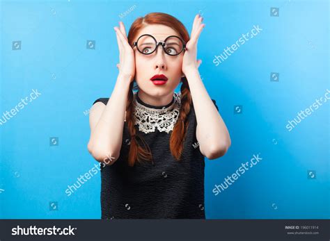 Surprised Redhead Girl On Blue Background Stock Photo Shutterstock