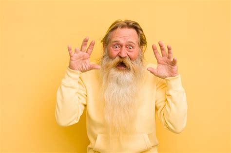 Premium Photo Screaming In Panic Or Anger Shocked Terrified Or Furious With Hands Next To Head