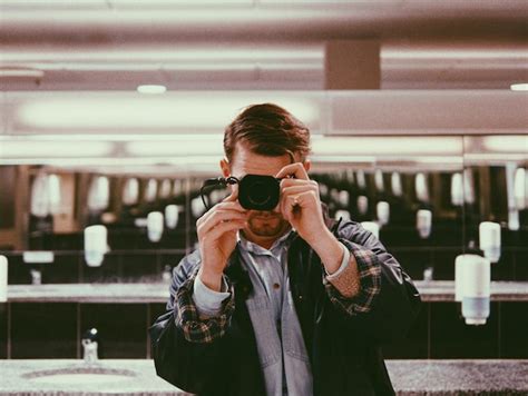 Premium Photo Man Photographing In Public Restroom