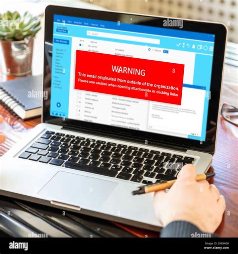 Email Attachments Warning Message On A Laptop Screen Computer Virus And Antivirus Cyber