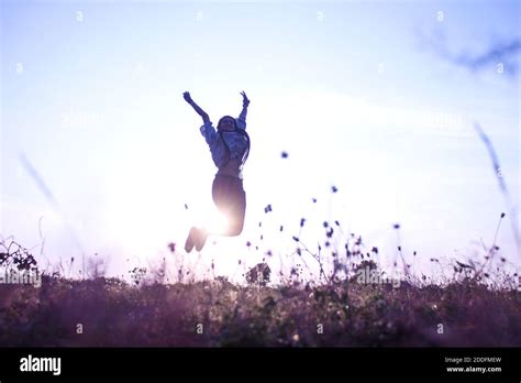 Happy Girl Jumped Against Sun With Open Hand Wallpapers And