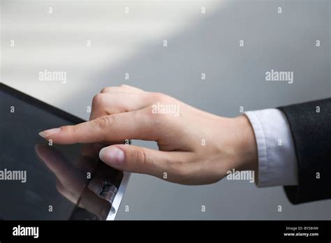 Woman S Hand Touching Tablet Computer Stock Photo Alamy
