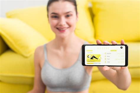 Premium PSD Blurred Woman Holding Mobile Phone Mock Up