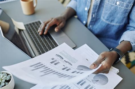 Premium Photo Close Up Of Unrecognizable Man Analyzing Documents With