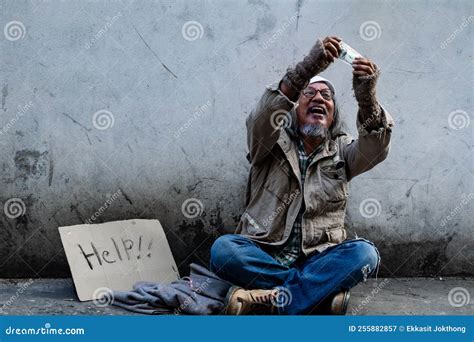 Asian Homeless Man Rejoices After Receiving Banknotes From Passersby To