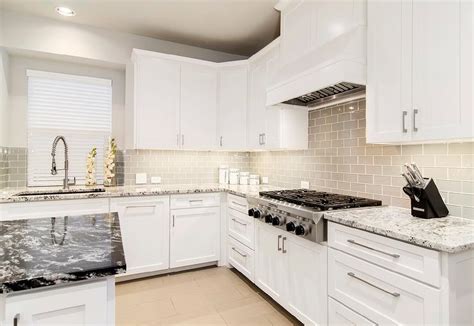 White Shaker Kitchen Cabinets With Gray Glass Tiles Contemporary