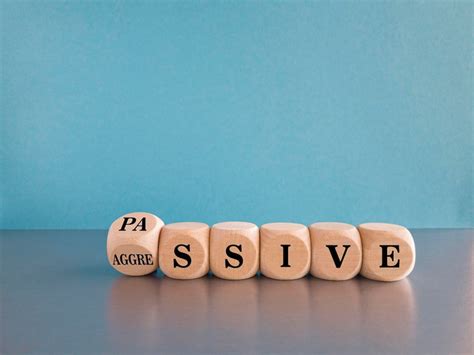 Premium Photo Passive Or Aggressive Symbol Turned A Wooden Cube And