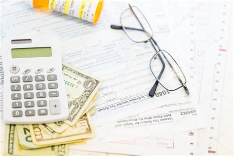 Calculator Cash And Glasses Tax Return Stock Photo By Urban Light 52331091