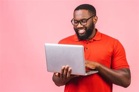 Premium Photo Young Smiling African American Man Standing And Using Laptop Computer Man