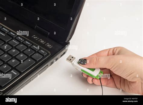 Hand Inserting Usb Memory Stick To Laptop Computer Stock Photo Alamy