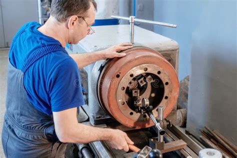 Elderly Metal Turner Works In Workshop Behind Lathe Authentic Workflow