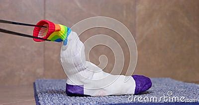 Someone Takes Dirty Smelly Sock Standing On Mat Using Tweezers Stock Footage Video Of