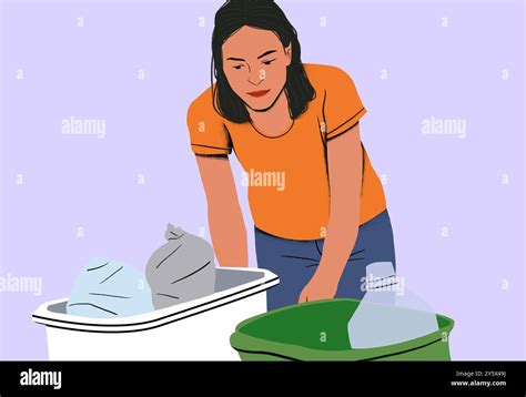 A Woman Sorting Recycling Materials Into Separate Bins Stock Photo Alamy