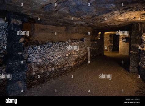 In The Paris Catacombs A Long Underground Path With Structures Formed By Human Bones Near