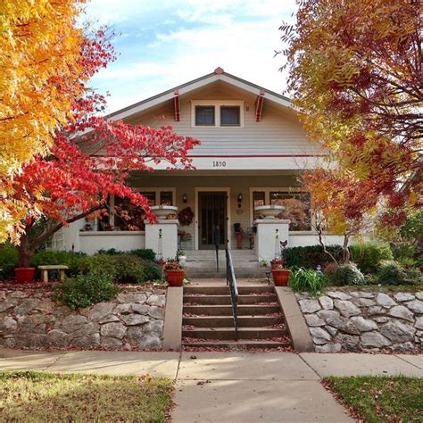 Craftsman Bungalow With Fall Foliage And Trees