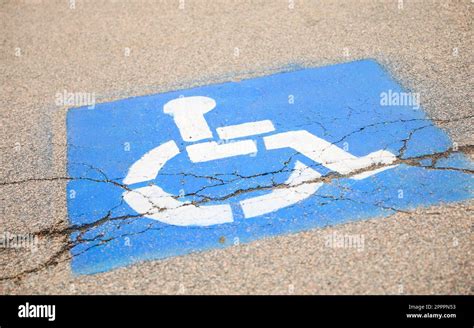 The Blue Handicap Sign On The Street A Universal Symbol For Accessibility And Mobility Aid For