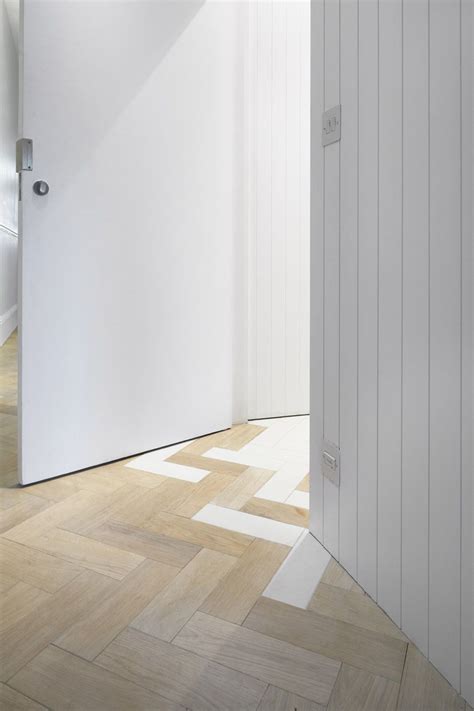 herringbone patterns feature inside angular house extension by platform