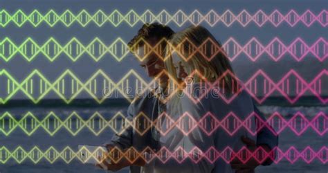 By Ocean Couple With Colorful Dna Strand Animation Overlaying Scene