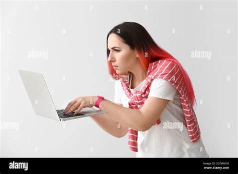 Female Programmer Using Laptop On Light Background Stock Photo Alamy