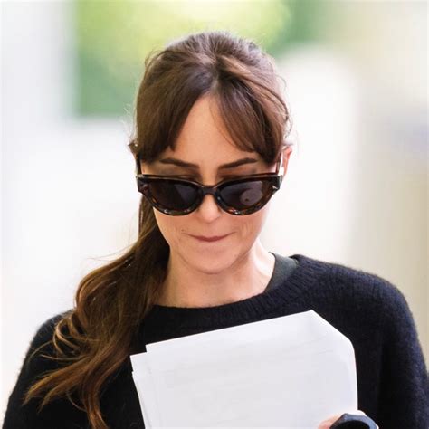 Dakota Johnson Is Giving Sexy Cyborg In A Sheer Knit Dress And Red Statement Shades Glamour