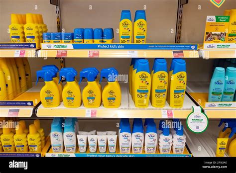 Various Bottles Tubes Of Sunscreen Protection Products On Shelf In
