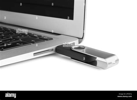 Modern Usb Flash Drive Attached Into Laptop On White Background Closeup Stock Photo Alamy