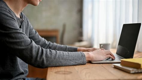 Premium Photo Side View Image Of A Young Asian Man Typing On Keyboard