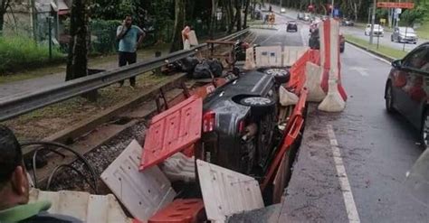 Car Crashes Into Temporary Barrier Falls Into Hole In Road Driver And