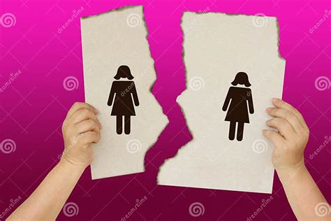 Female Hands Holding A Torn Poster Separating The Symbols Of Two Women