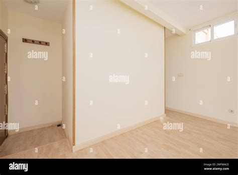 Empty Living Room With Oak Front Door Light Driftwood Flooring And