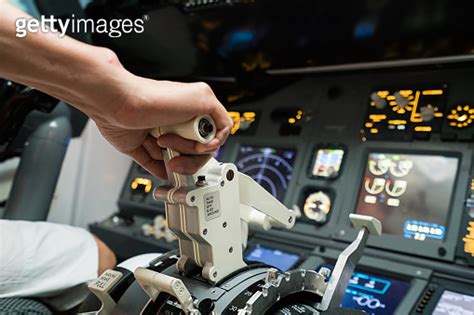Pilot pushing buttons in the cockpit 이미지 게티이미지뱅크