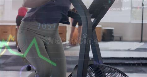 Image Of Data On Graph Over Caucasian Woman Cross Training On