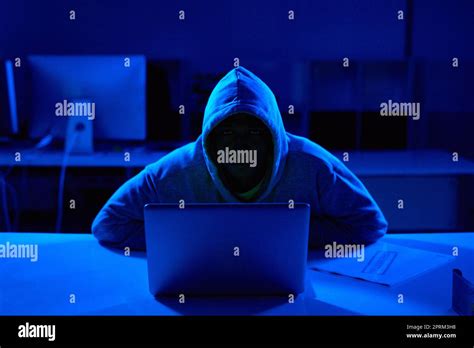 You Wont See It Coming Till Its Too Late An Unrecognizable Hacker Cracking A Computer Code In