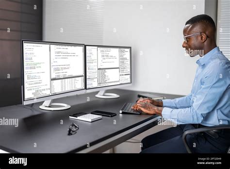 African American Coder Using Computer At Desk Web Developer Stock